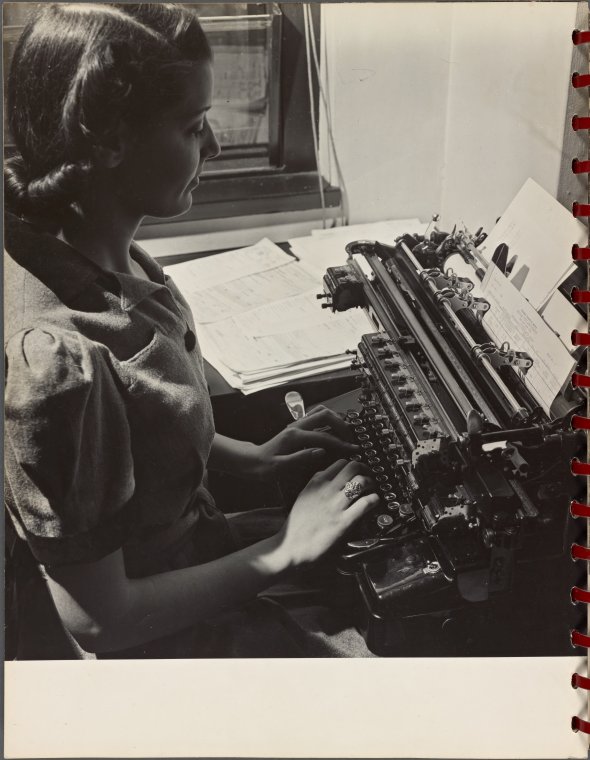 woman working at a typewriter - NYPL Digital Collections