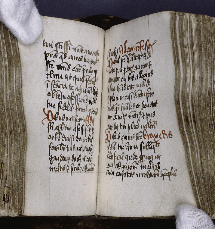 Girdle book opened -- shows 2 pages of text with red initials. - NYPL ...