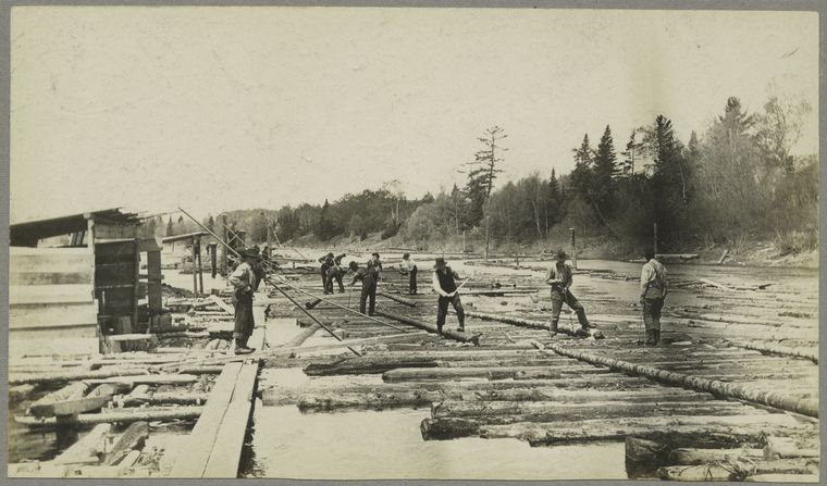 Bottom markers at work putting on boom poles, Douglas' Boom, St. John ...