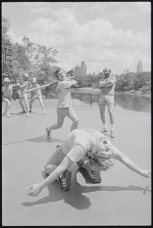 Performers rehearsing fight choreography (swords raised) for the stage ...