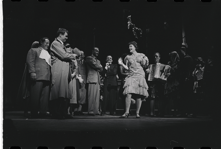 Edward Winter [left], Peg Murray [center] and ensemble in the stage ...