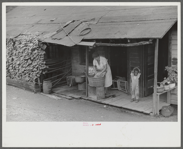Coal miner's wife washing clothes on front porch, Chaplin, West ...