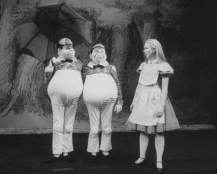 Actress Kate Burton as Alice with Tweedledum and Tweedledum in a scene ...