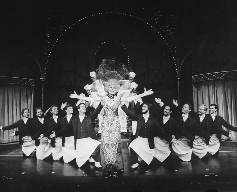 Carol Channing (C) with dancing waiters performing "Hello, Dolly!" in a ...
